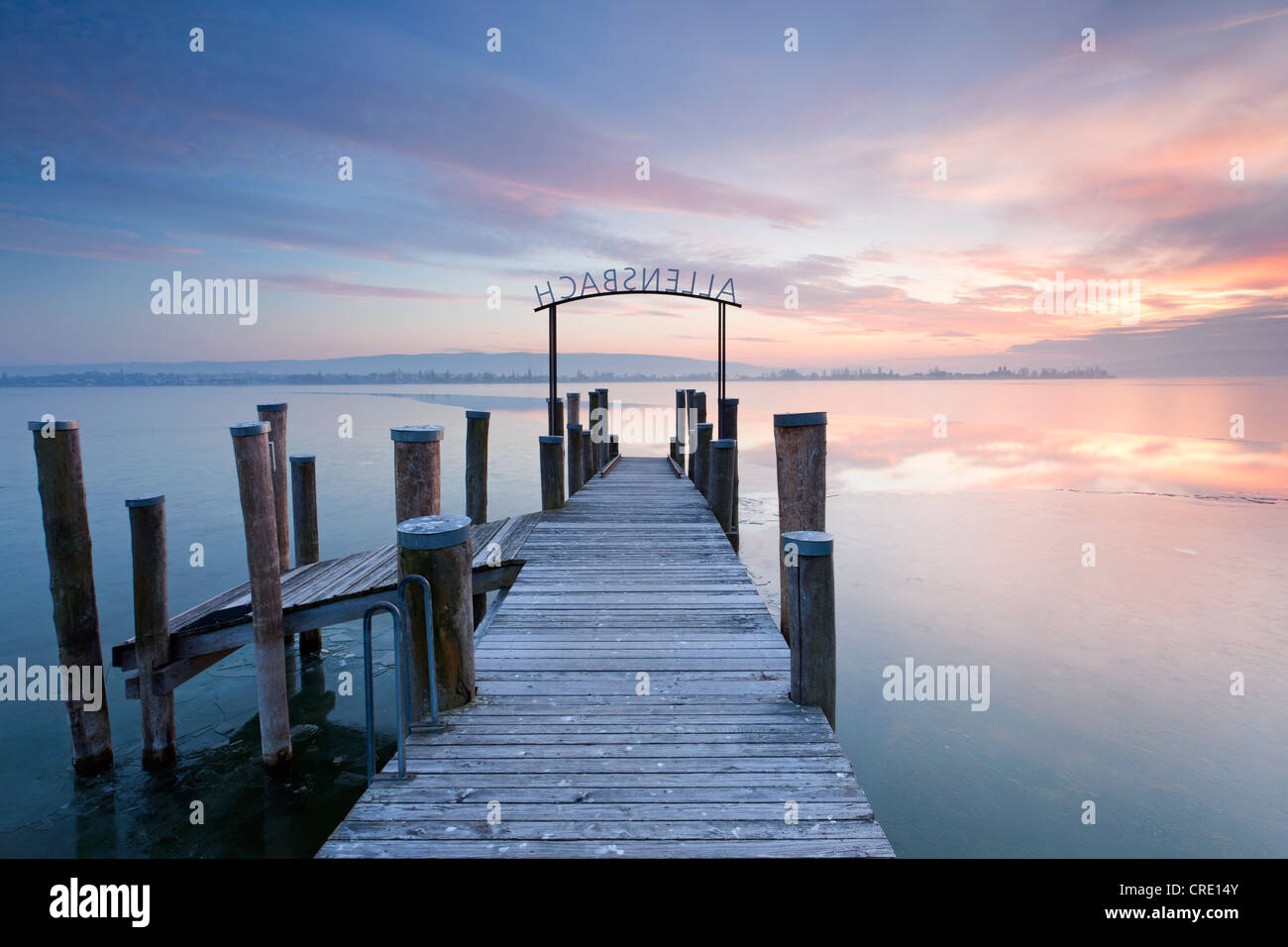 Evening mood at a wharf with ice on Lake Constance near Allensbach ...
