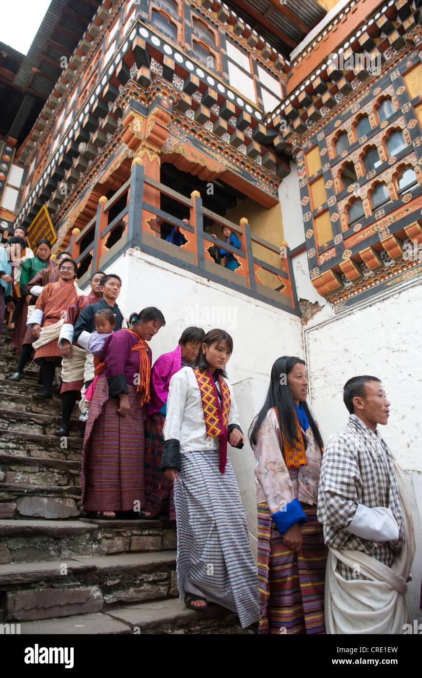 Tibetan Buddhist festival, people wearing the traditional Gho robe ...