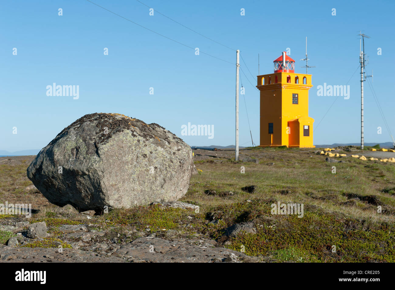 Yellow lighthouse with aerials, rock, Raufarhoefn, Iceland, Scandinavia ...