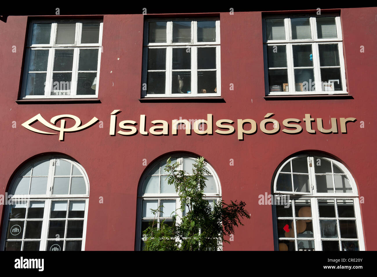 Building facade with logo of Islandspostur, Icelandic postal service ...