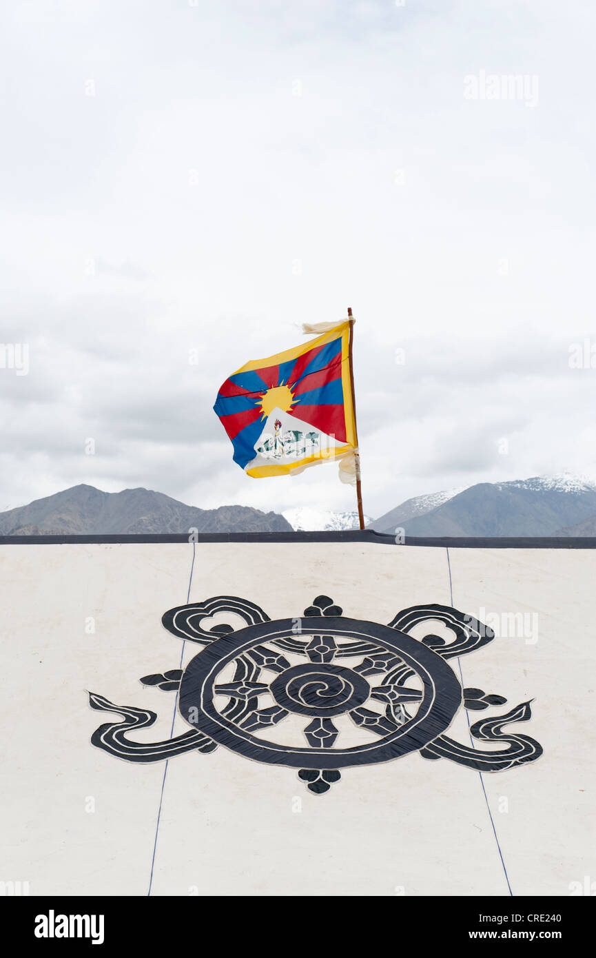 Tibetan flag and a symbol on the roof of a tent, Leh, Ladakh district ...