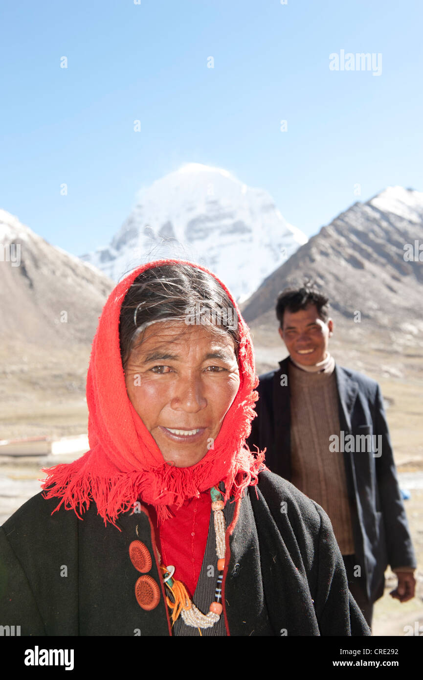 Tibetan Buddhism, Tibetan believers, woman and man, snow-capped sacred ...