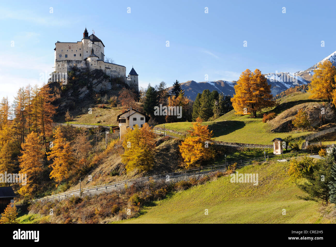 Tarasp Castle in an autumn-coloured landscape, Scuol, Lower Engadin ...