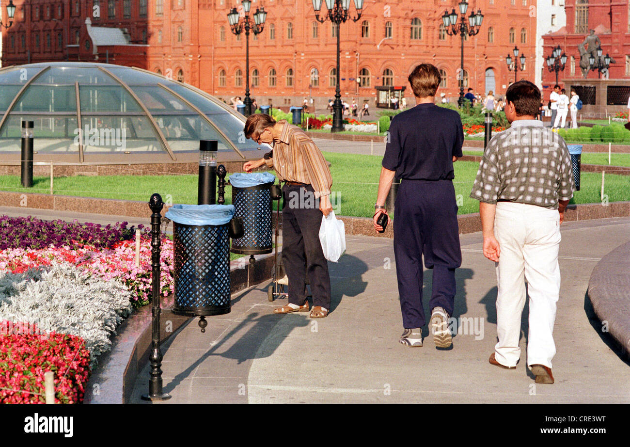 Moscow, older man looking through trash Stock Photo - Alamy