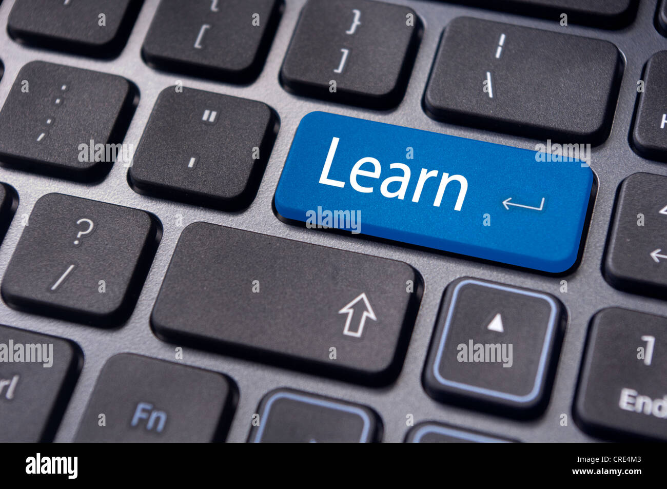 concept of learning, with message on computer keyboard enter button ...