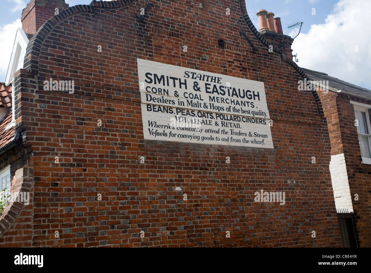 Old corn and coal merchant sign on building end Beccles, Suffolk ...