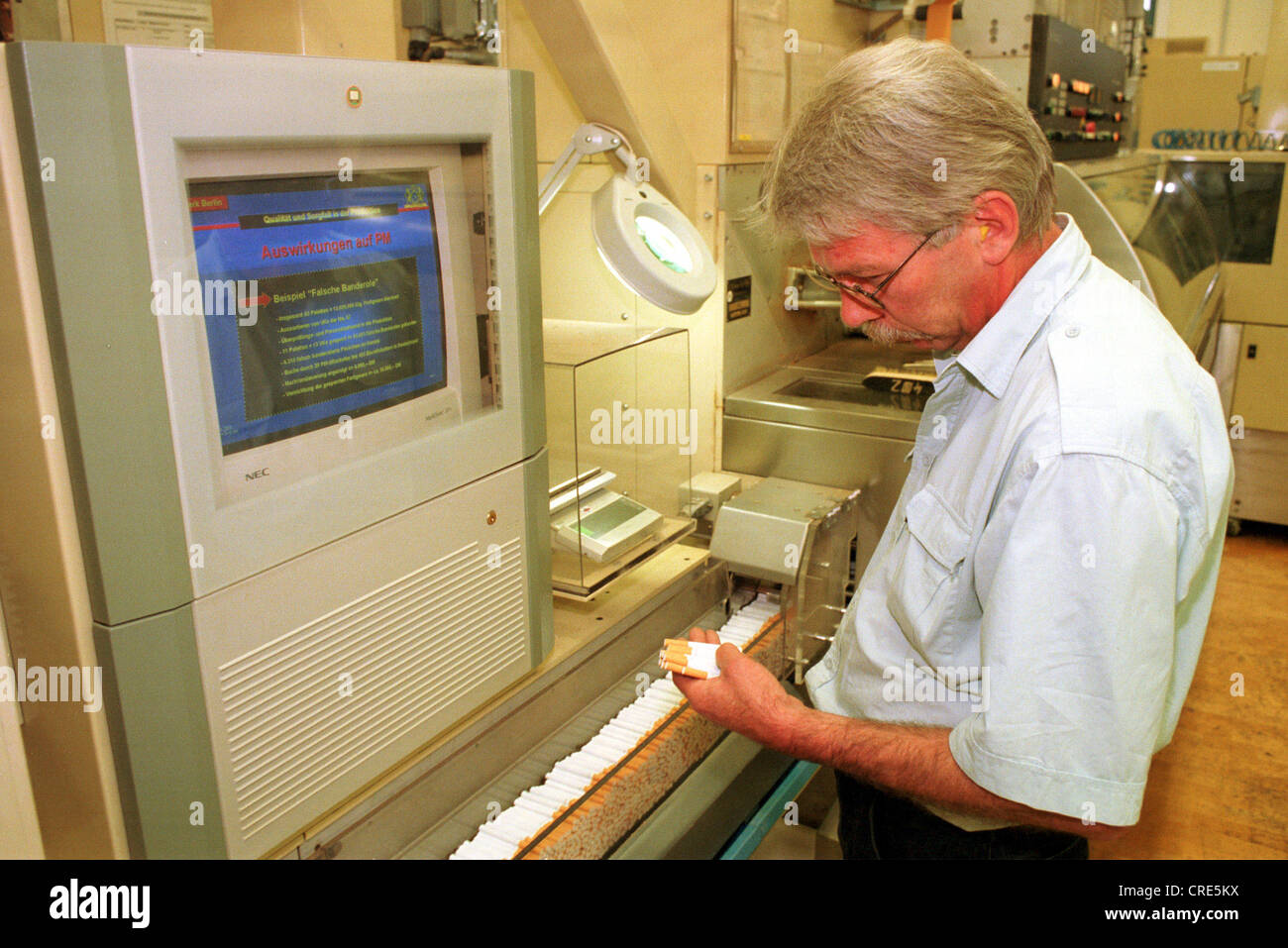 A worker at Philip Morris factory in Berlin-Neukoelln, Germany Stock ...