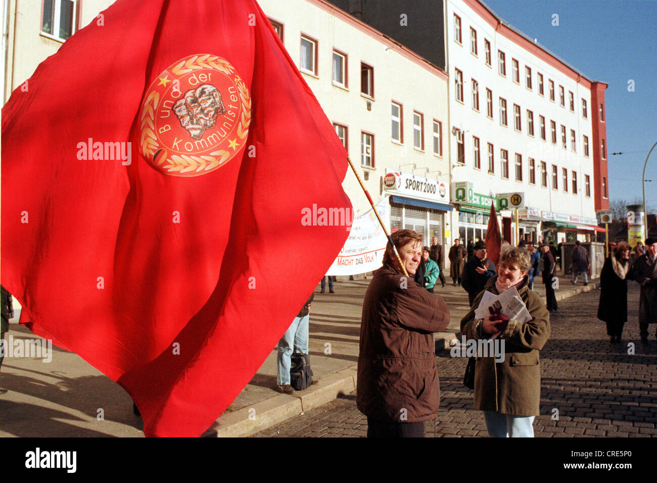 Man with flag of the Communist League in commemorative demonstration in ...