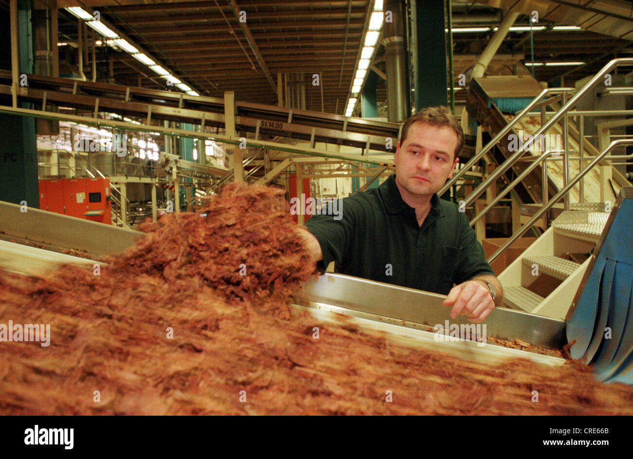 A worker at Philip Morris factory in Berlin-Neukoelln, Germany Stock ...