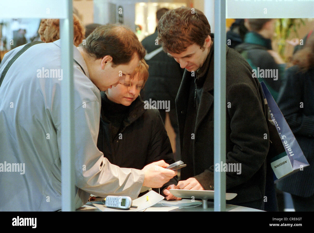 CeBIT 2001, visitors look at new mobile phone models, Hannover, Germany Stock Photo - Alamy