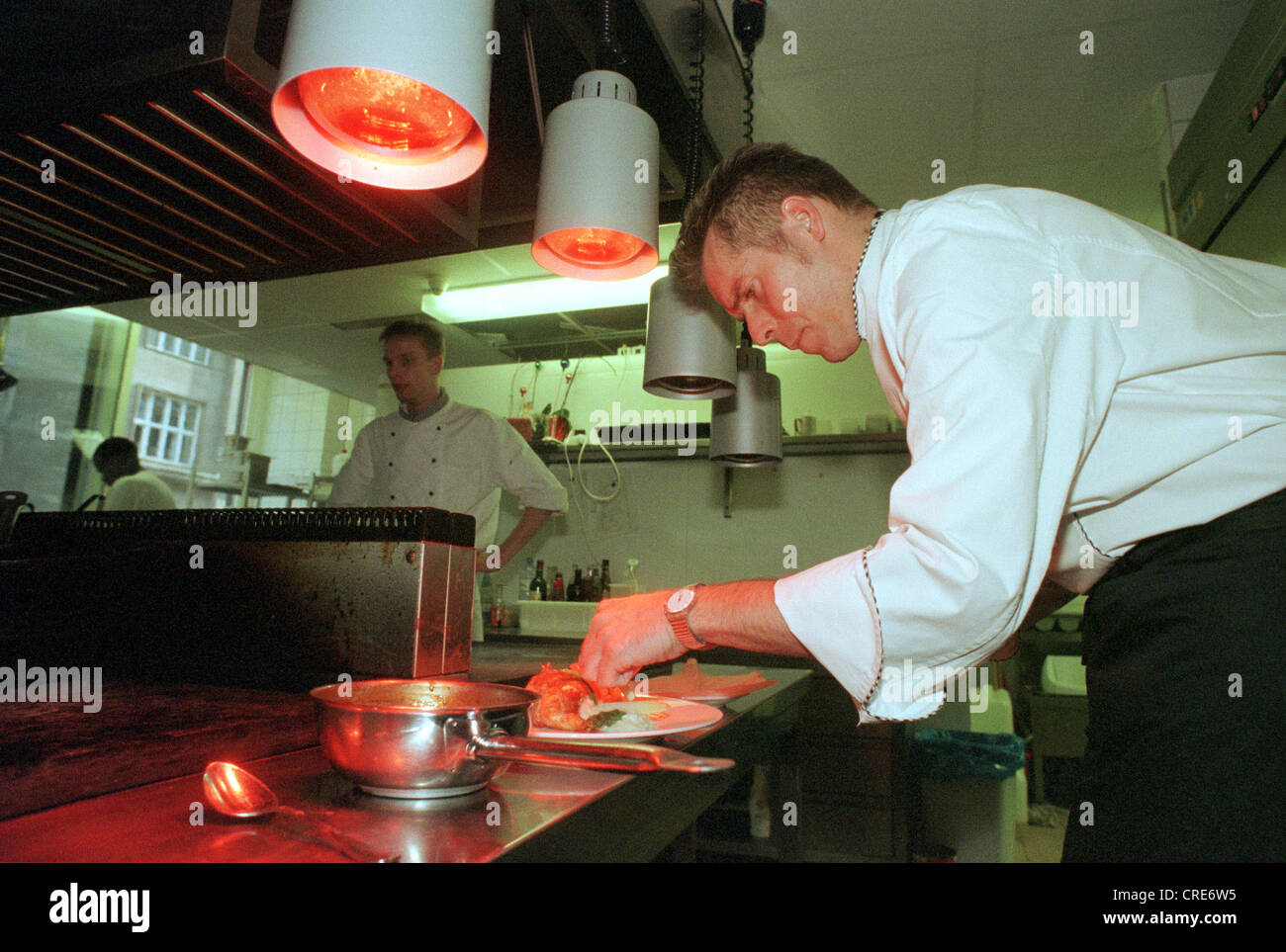 Cooking in the kitchen of the restaurant Langhans in Berlin-Mitte ...