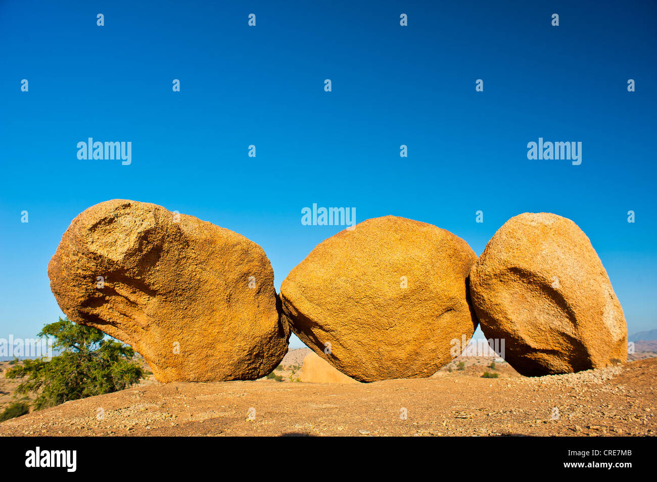 Large granite boulders on a rock ledge, Anti-Atlas Mountains, southern ...