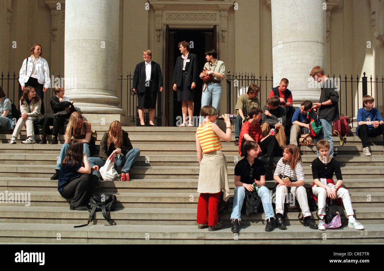Young people on the steps of the German Cathedral, Berlin, Germany ...