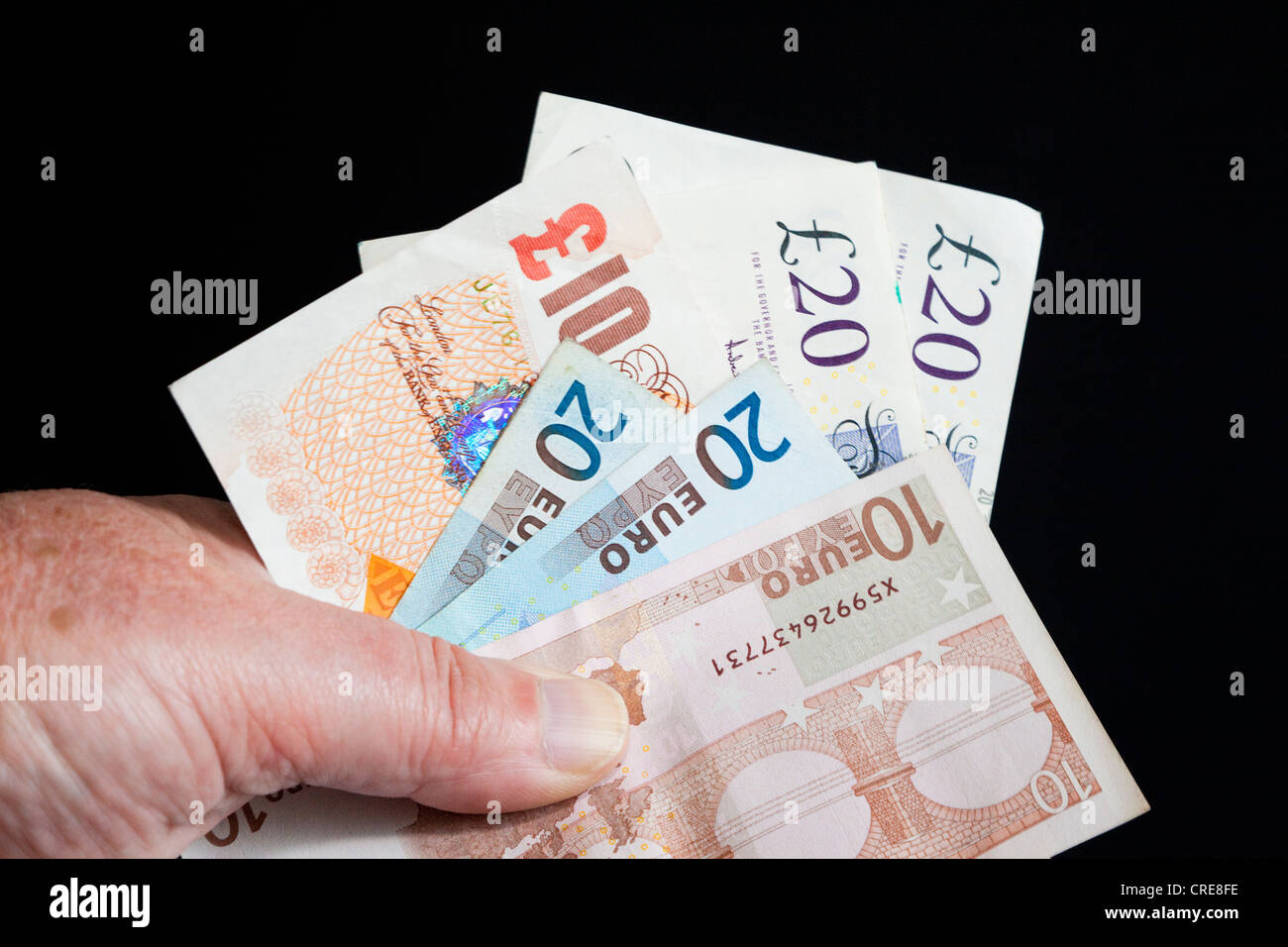 Holding 50 pound note british hi-res stock photography and images - Alamy