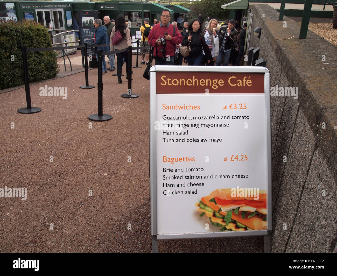 Cafe sign and tourists at Stonehenge, England, May 16, 2012 ...