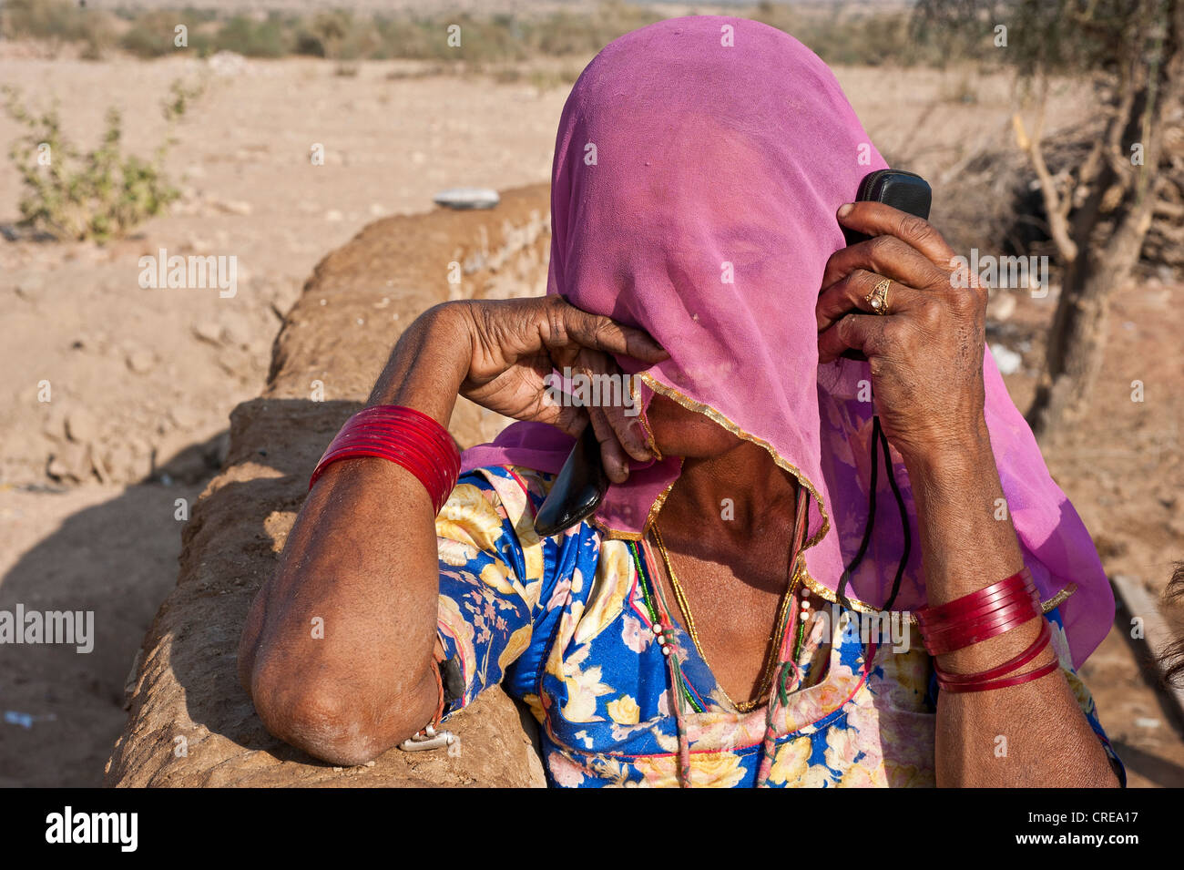 Veiled Indian woman speaking on the mobile phone, Thar Desert, Rajasthan, India, Asia Stock ...