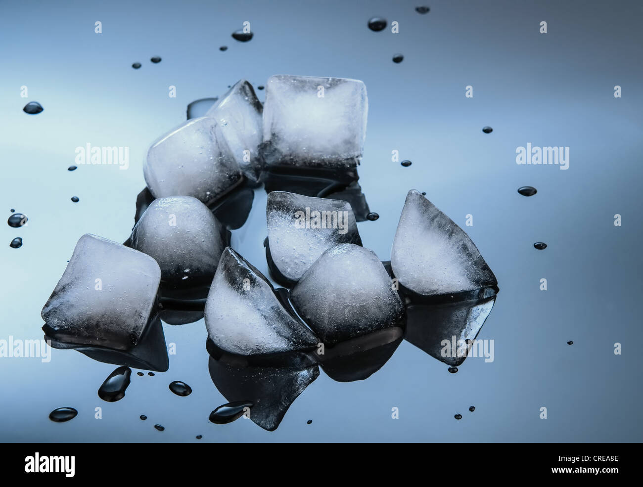 wet ice cubes on black glossy mirror background Stock Photo - Alamy