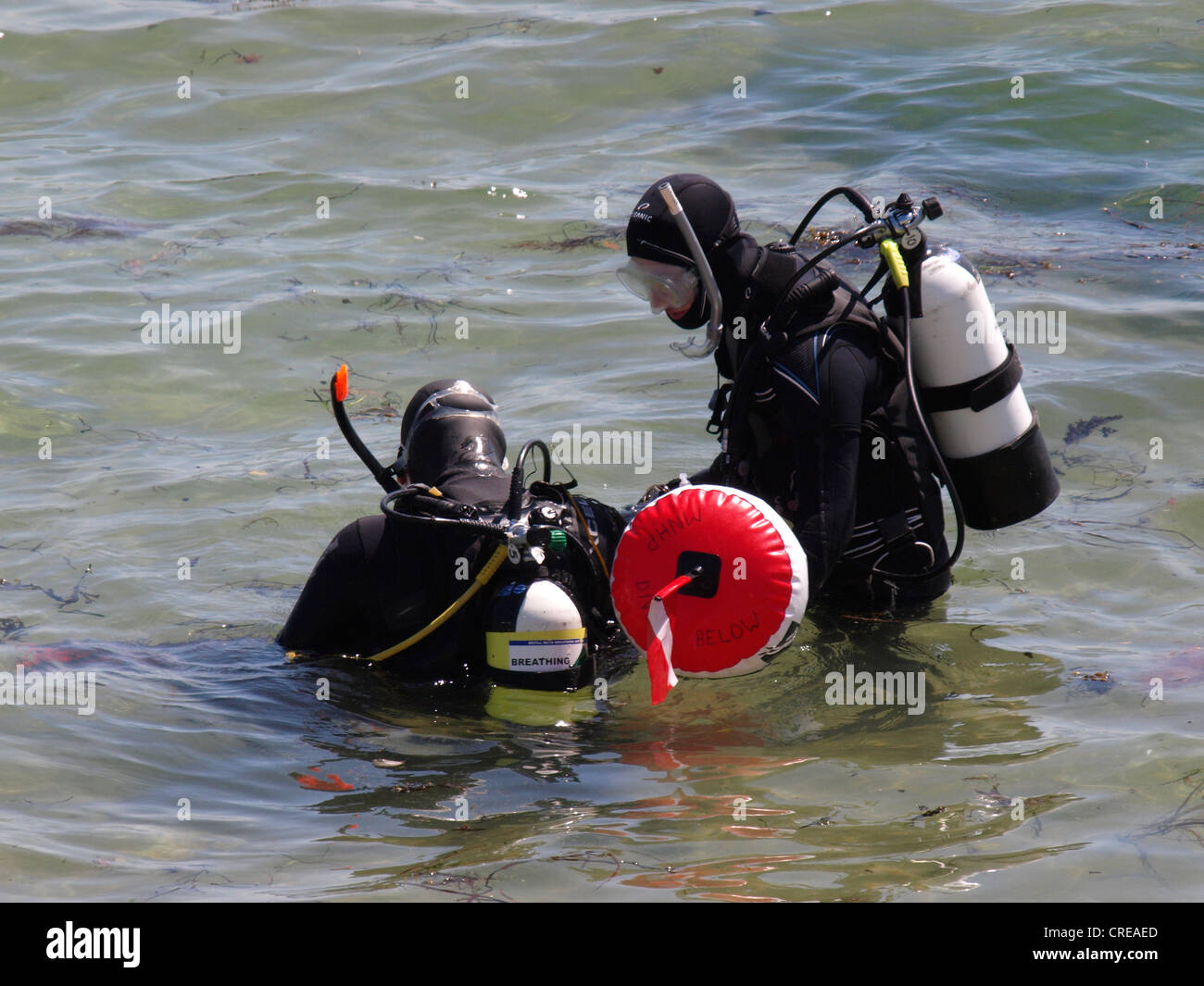 Divers entering water hi-res stock photography and images - Alamy
