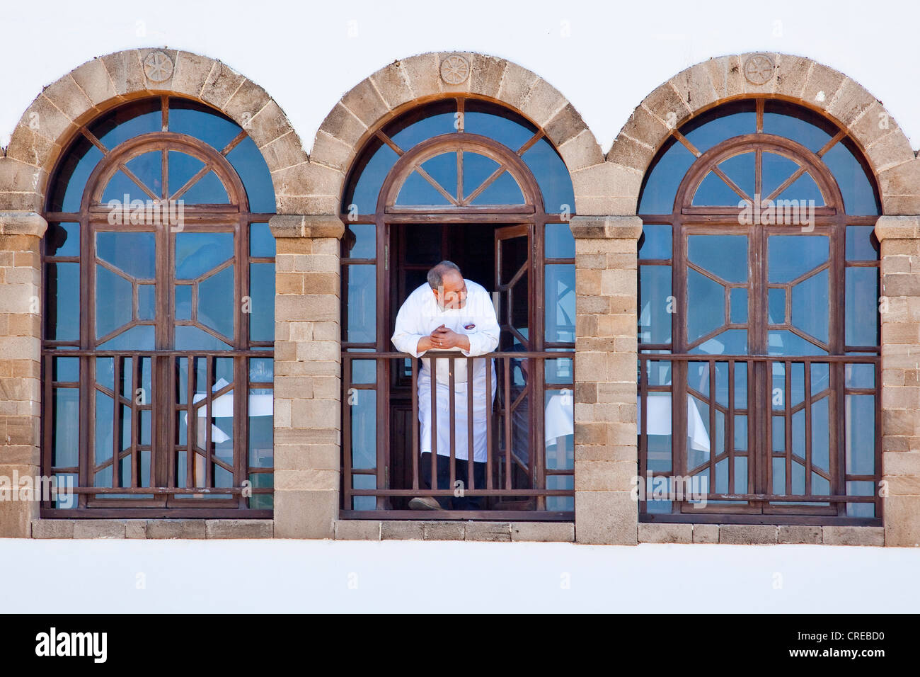 Cook looking out window hi-res stock photography and images - Alamy