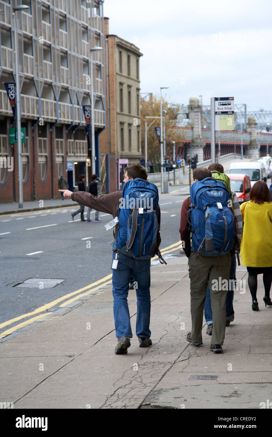 three male backpackers walking in the city of glasgow scotland uk Stock ...