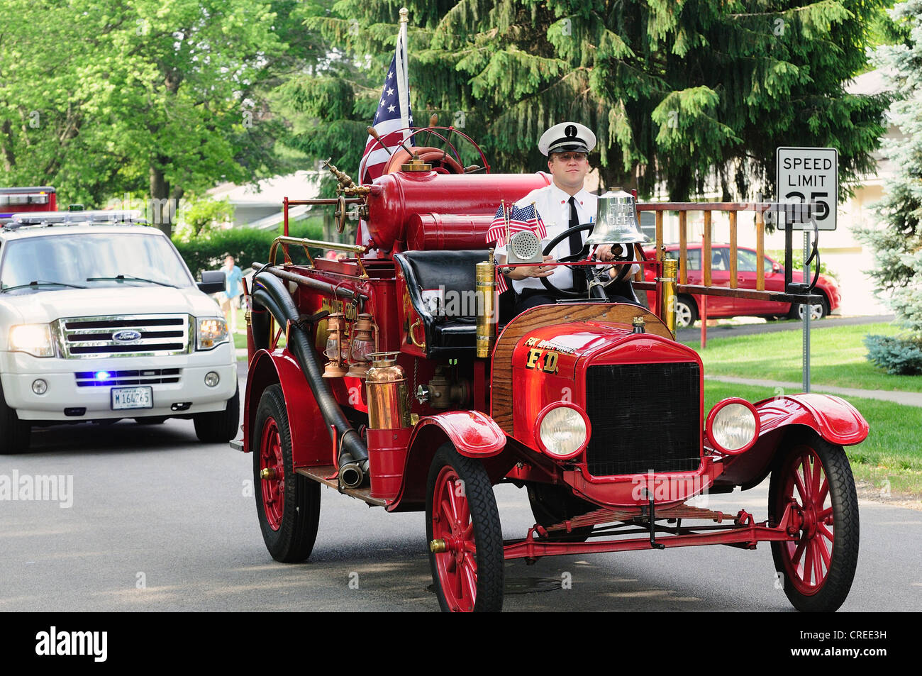 A vintage 1923 fire engine from small town America riding in the ...