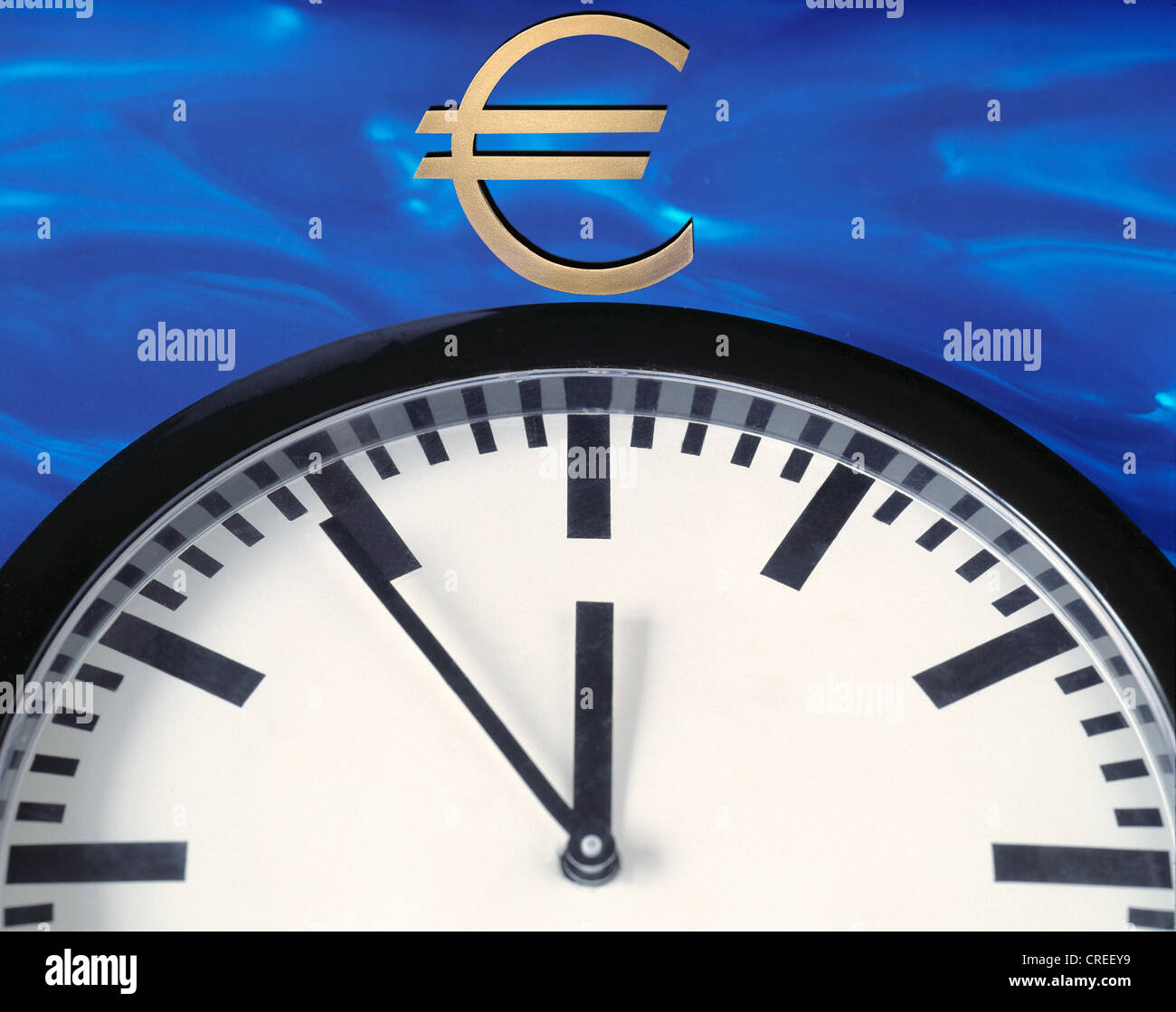 Clock showing 11:55, with Euro symbol Stock Photo - Alamy