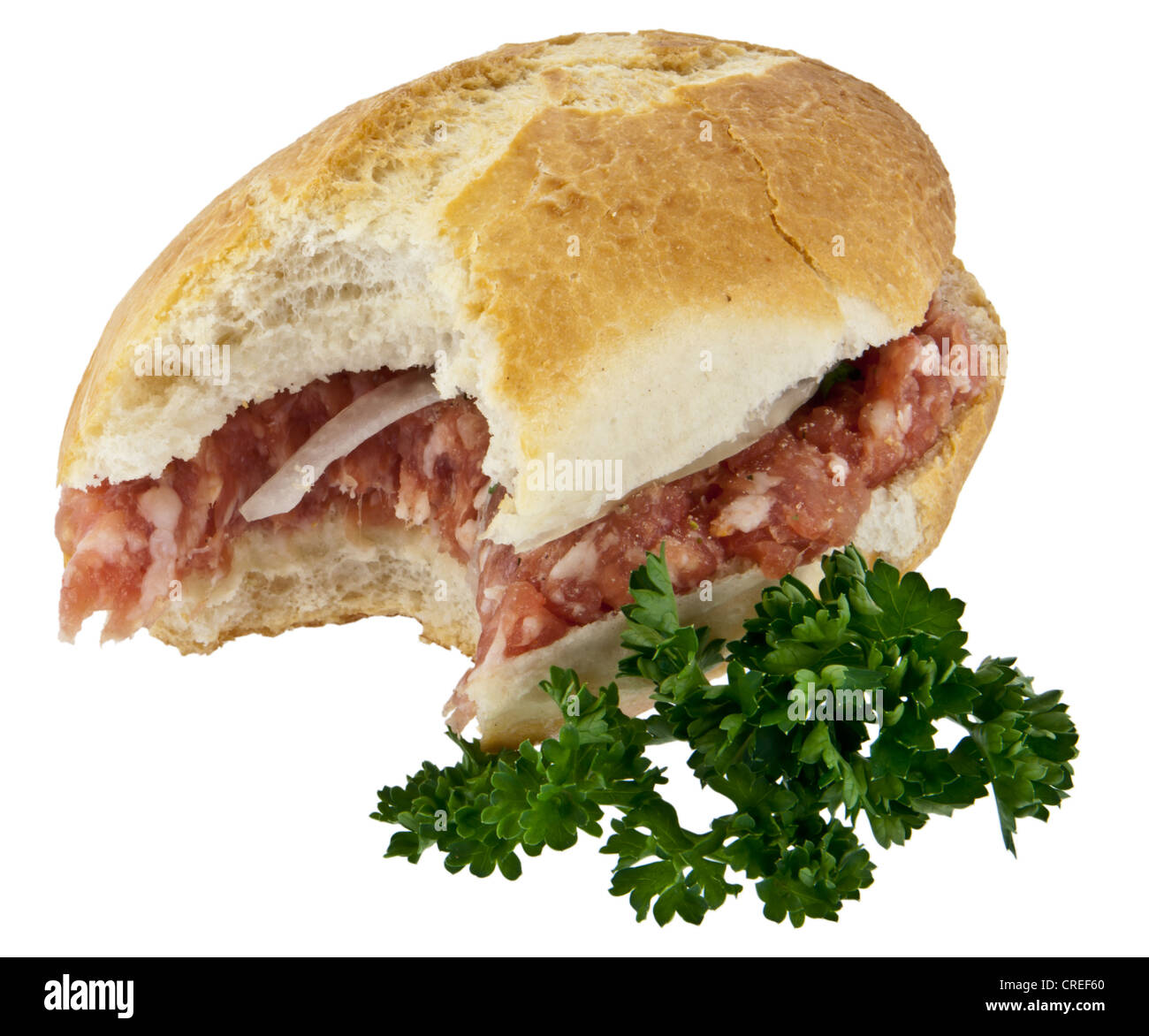 Bitten off roll with minced pork (In German called Mettbrötchen ...