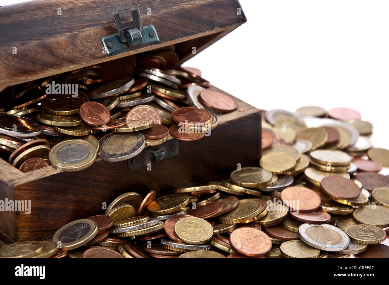 Wooden treasure box (macro view) with coins isolated on white ...