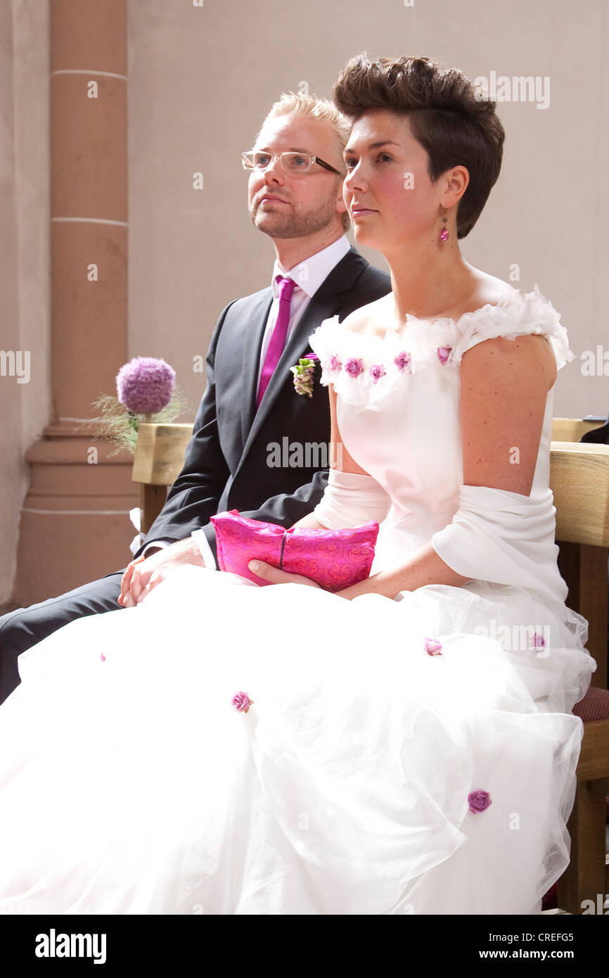 Bride and groom during the church wedding, Regensburg, Bavaria, Germany ...