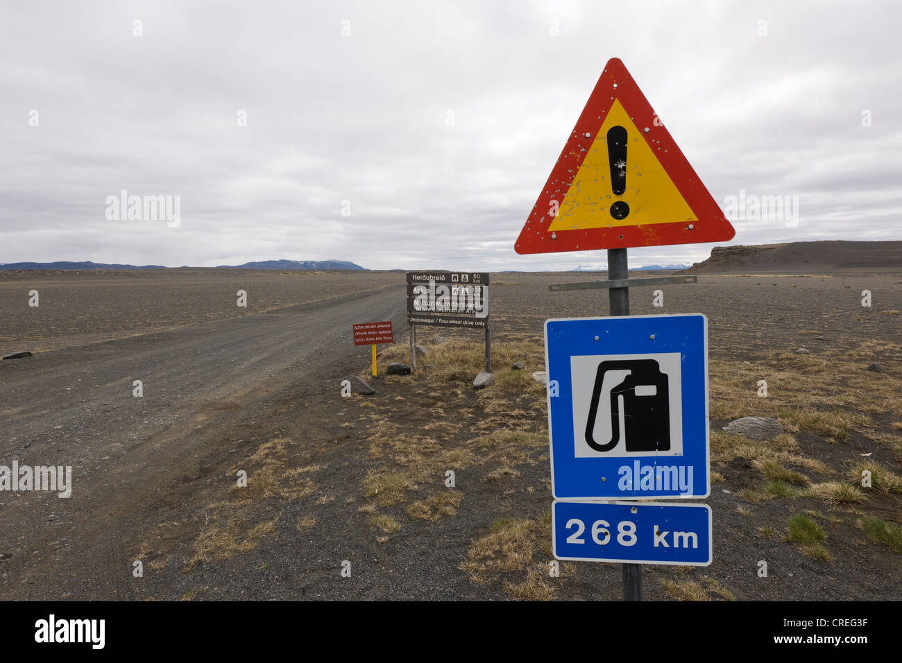 Traffic sign and warning sign on a high-altitude road "next petrol ...