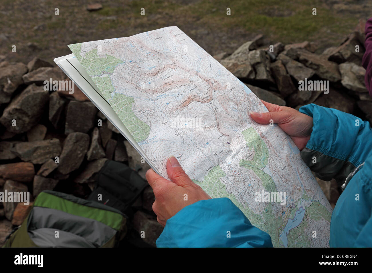Walker Reading a Map on the Summit of Merrick Dumfries and Galloway ...