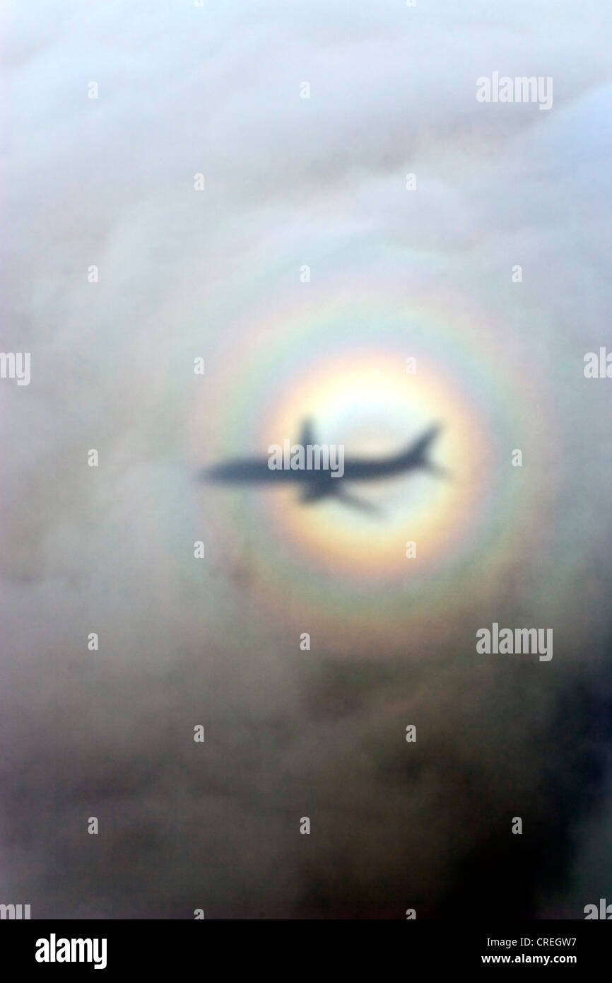 plane shadow on clouds with rainbow Stock Photo - Alamy