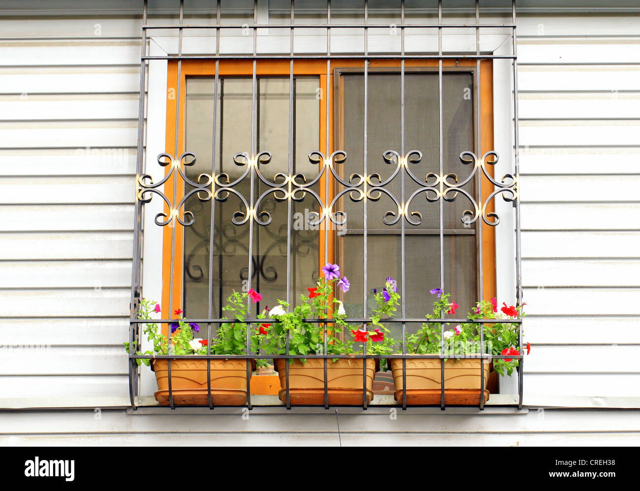 window on the wall, decorated with flowers and the lattice Stock Photo ...