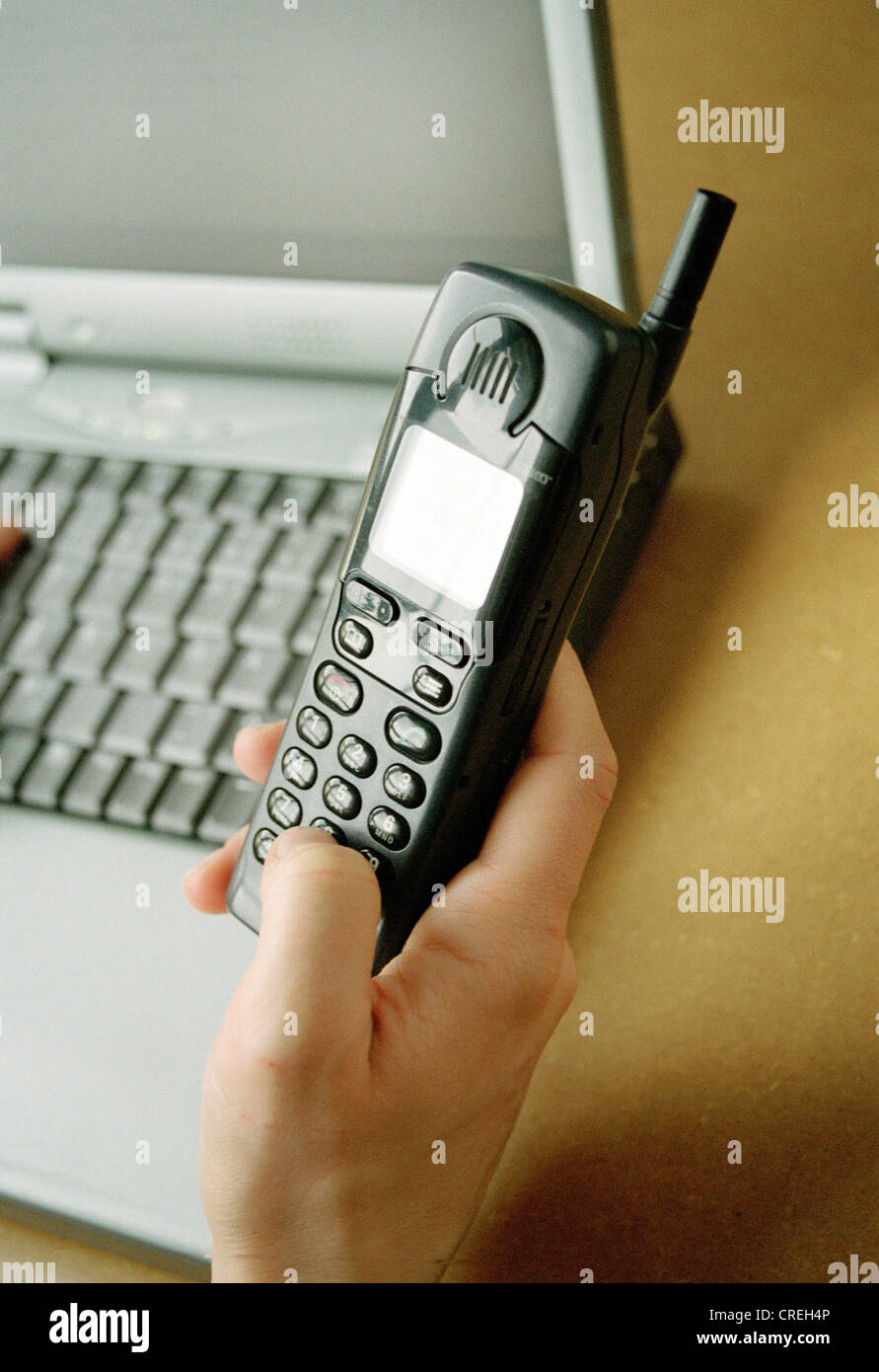 User of computer and mobile phone Stock Photo - Alamy