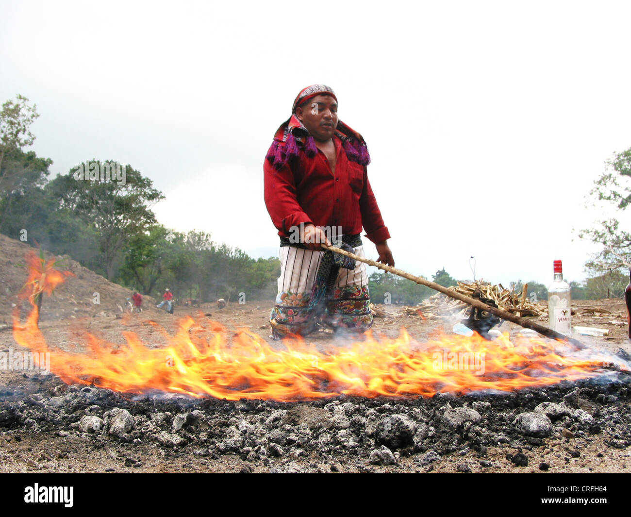 Mayan priests in ritual with Maya altar, burning candles and ...