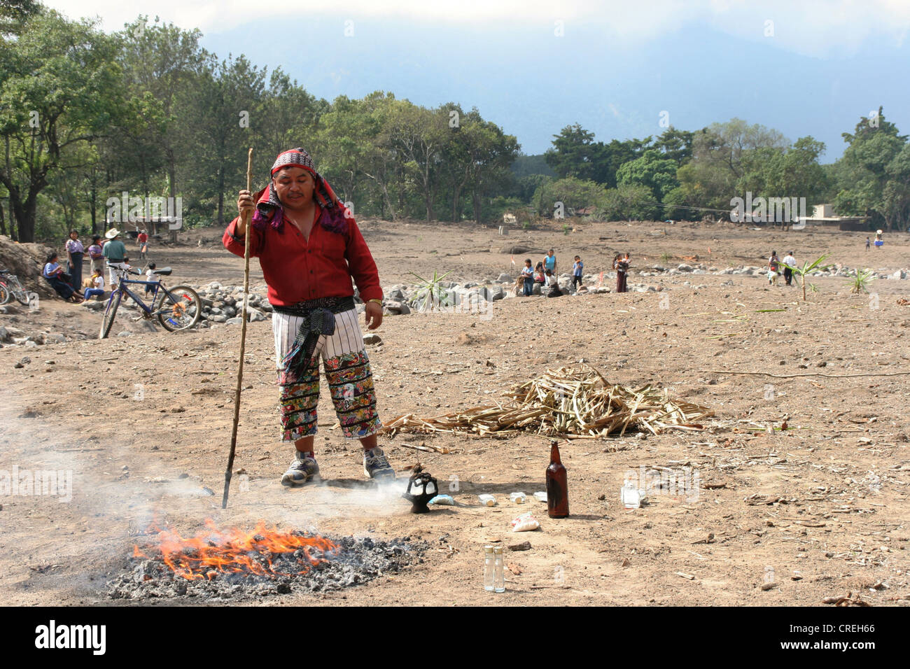 Mayan priests in ritual with Maya altar, burning candles and ...