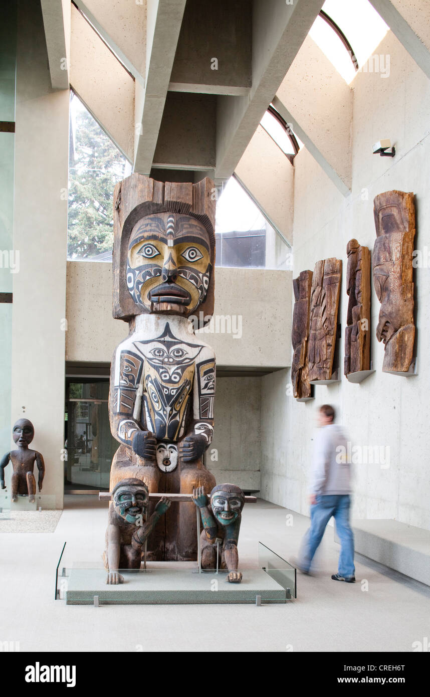 A man walks through a museum filled with Native American art Stock ...