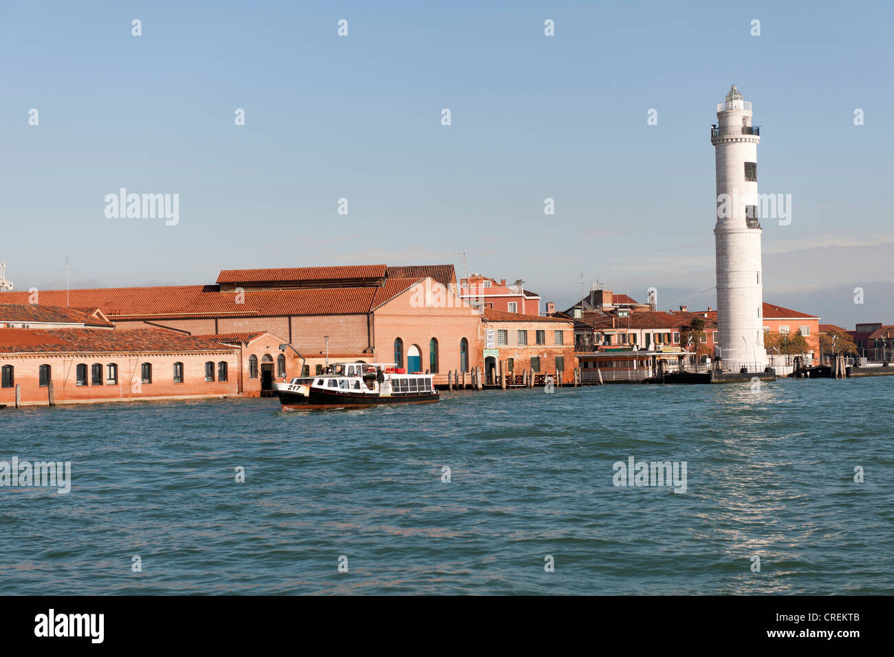 Glass shops, lighthouse and vaporetto station Murano, lagoon island of ...