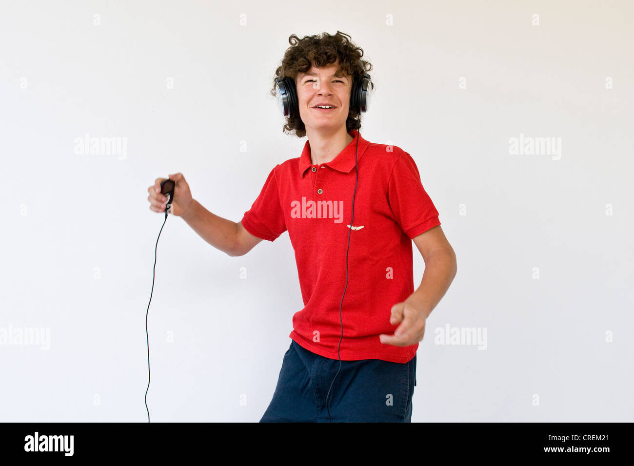 Boy listening to music Stock Photo - Alamy