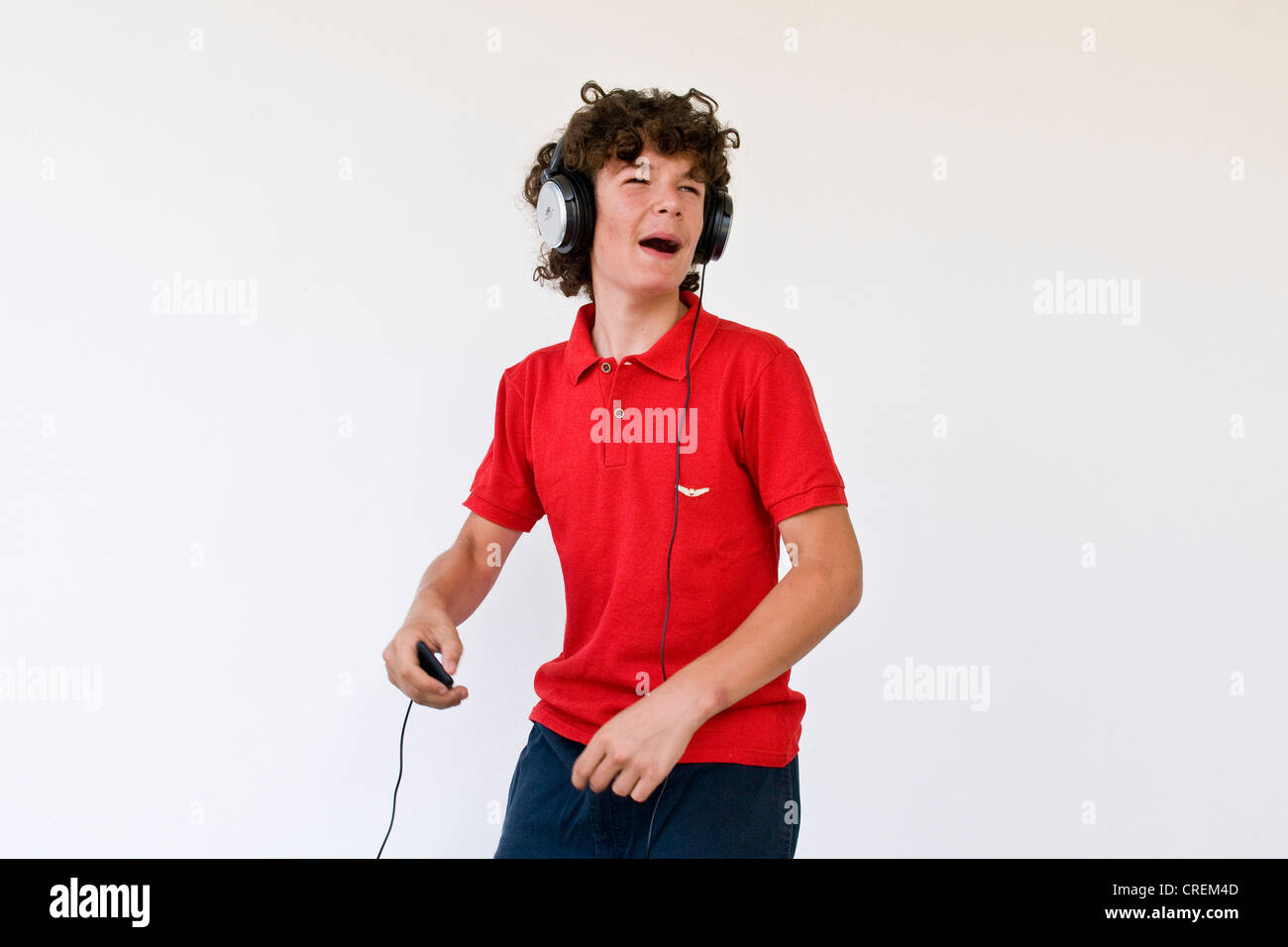 Boy listening to music Stock Photo - Alamy