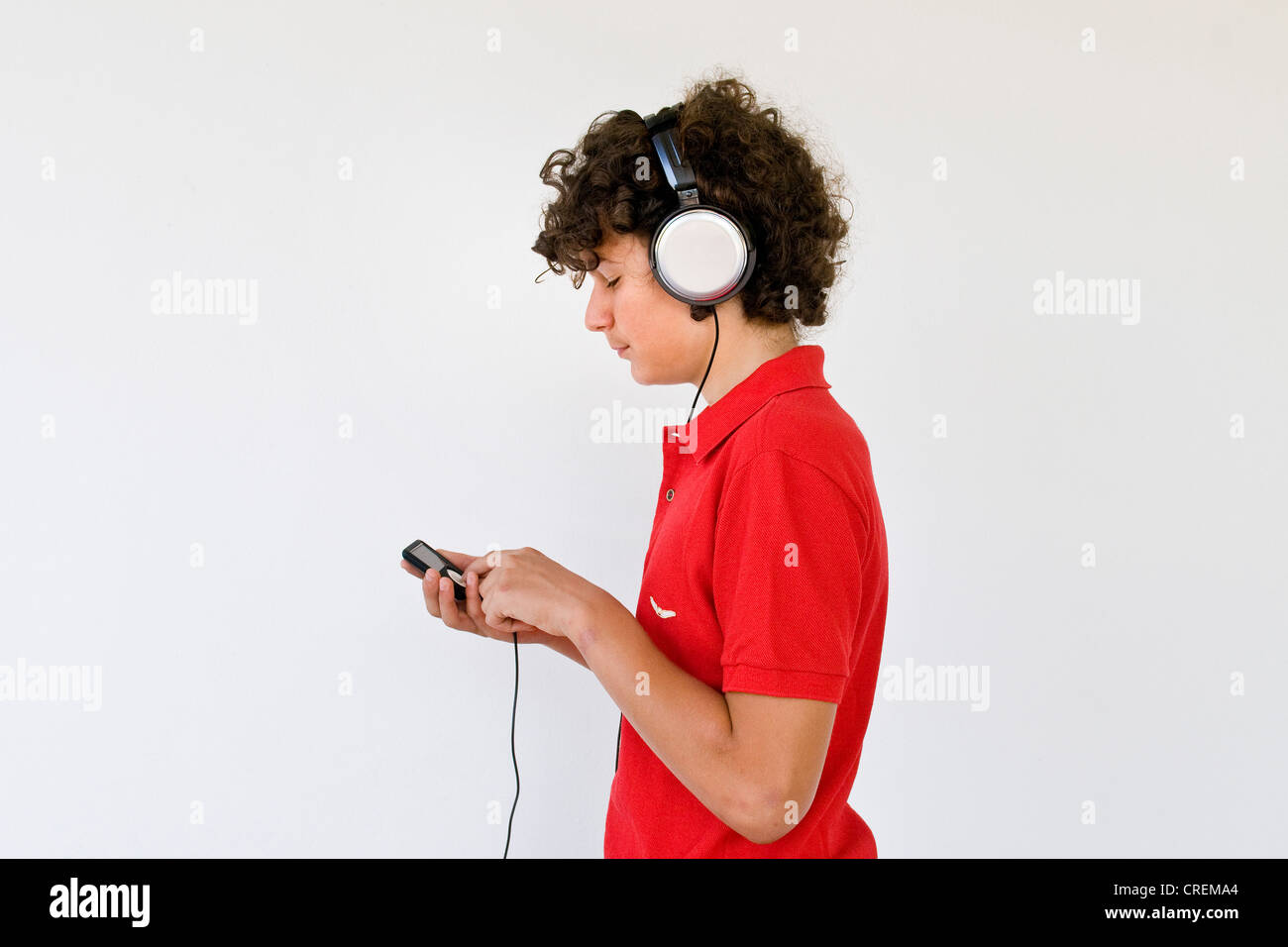 Boy listening to music Stock Photo - Alamy