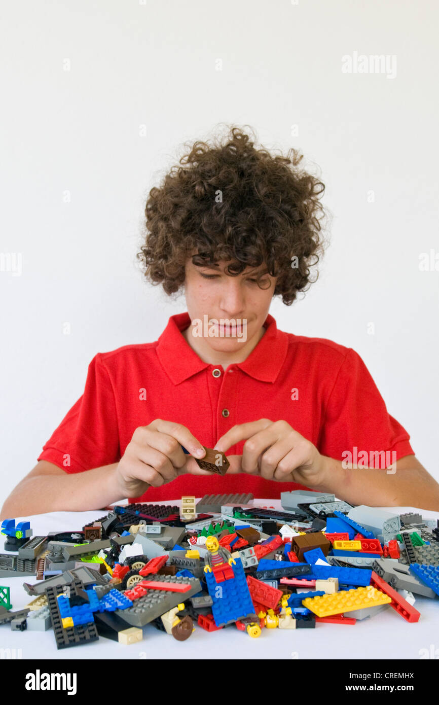 Boy playing with Lego Stock Photo - Alamy