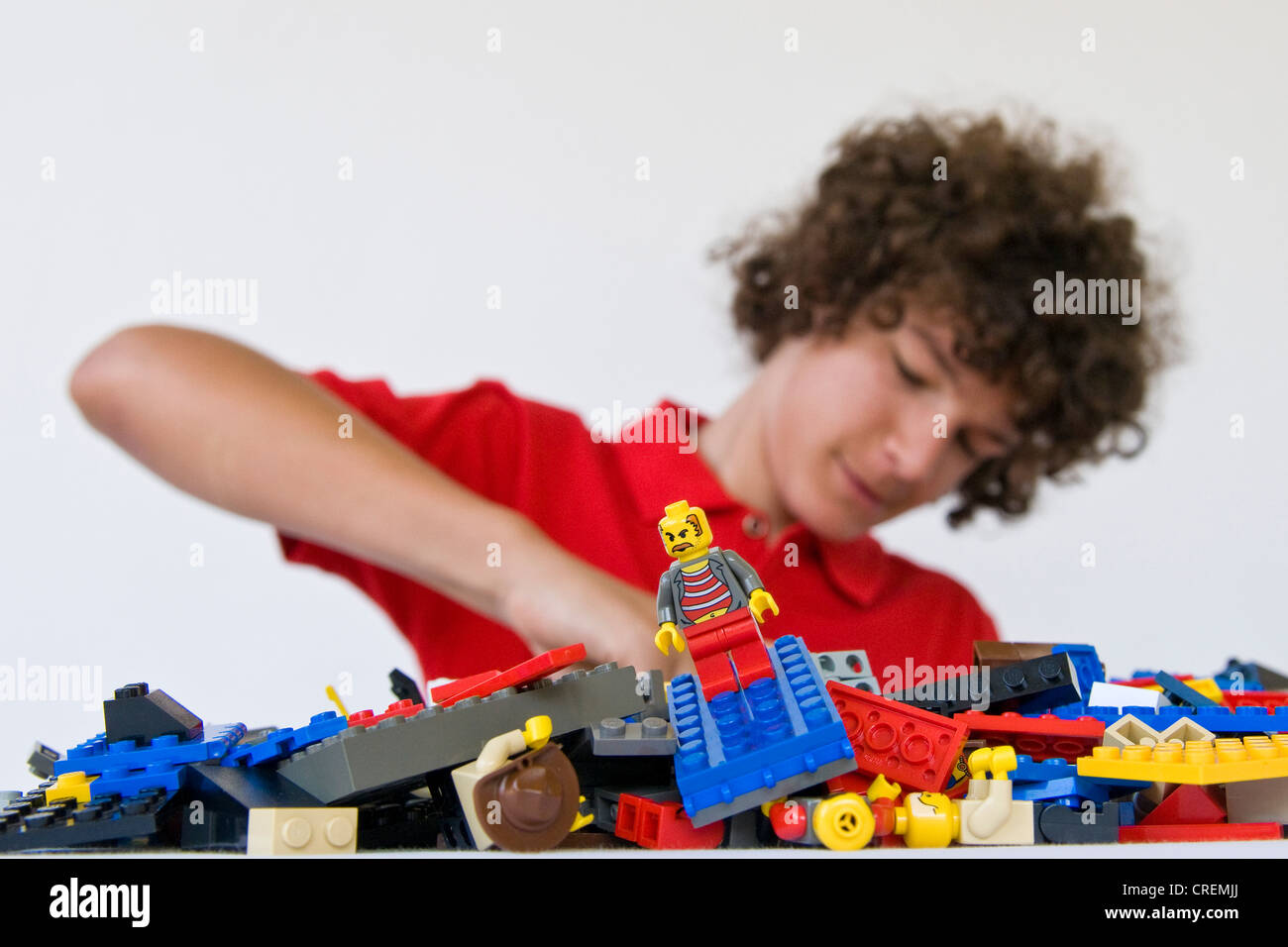 Boy playing with Lego Stock Photo - Alamy