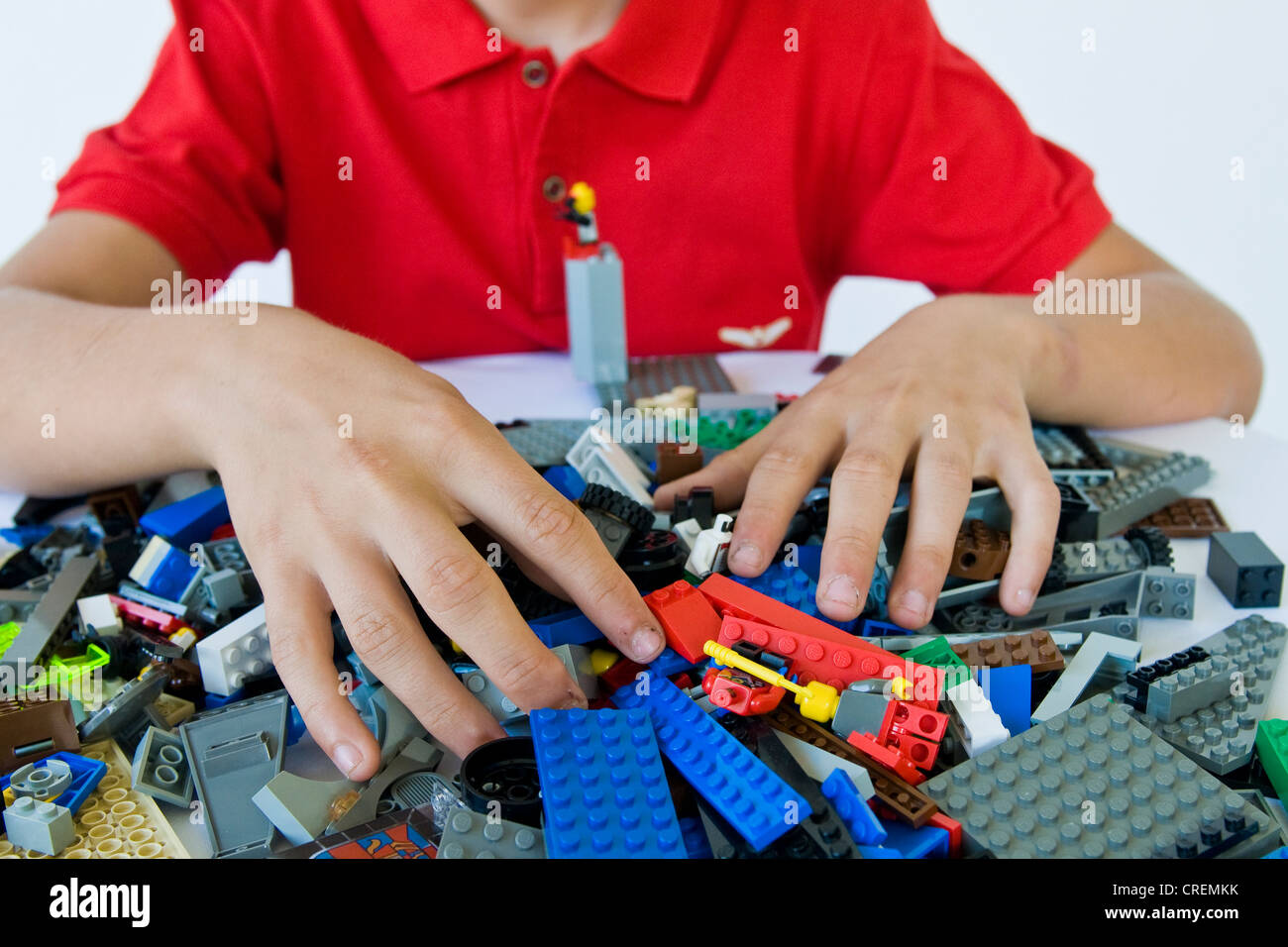 Boy playing with Lego Stock Photo - Alamy