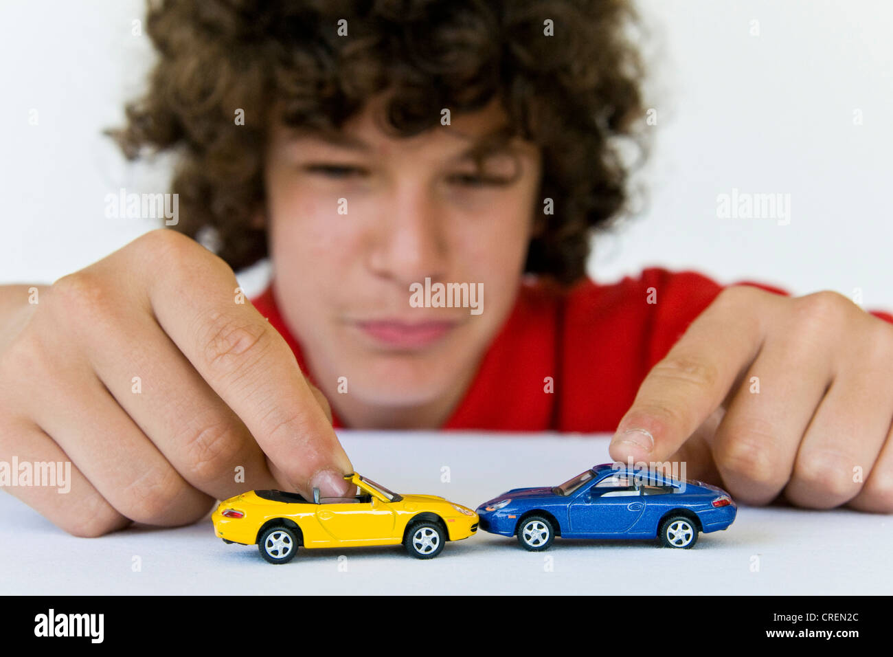 Boy playing with model cars Stock Photo - Alamy