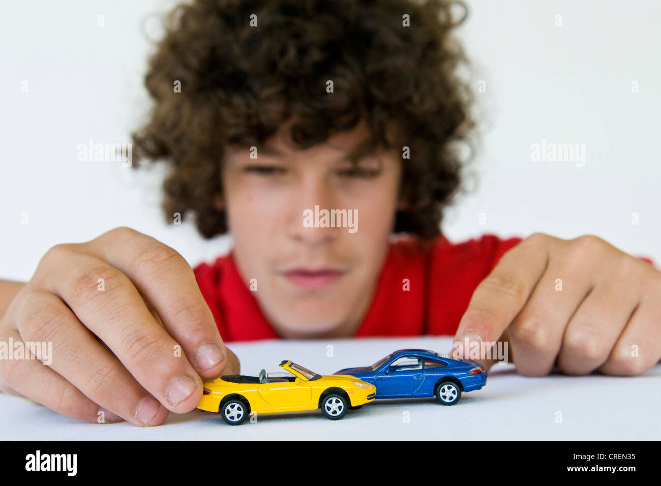 Boy playing with model cars Stock Photo - Alamy