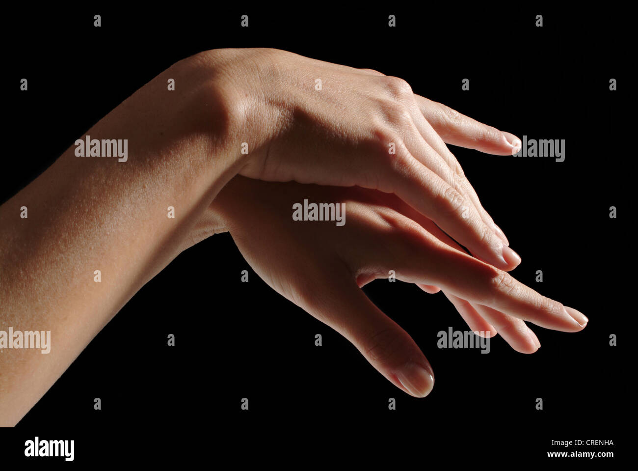 woman hands on black background Stock Photo - Alamy