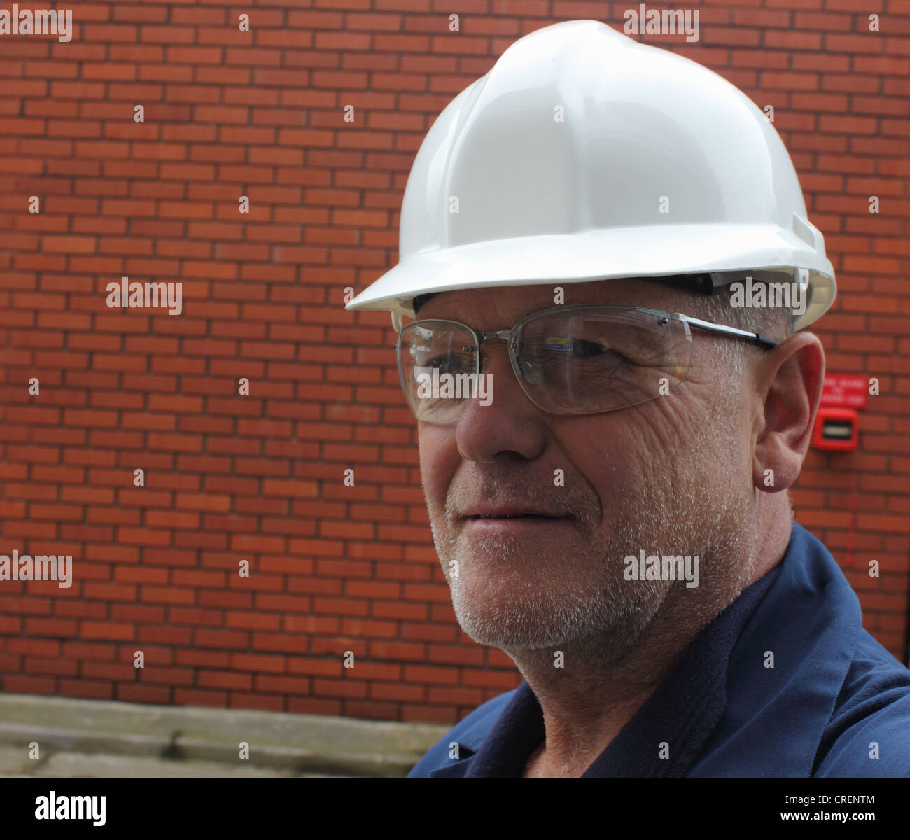 An engineer wearing safety glasses & hard hat, ppe Stock Photo - Alamy