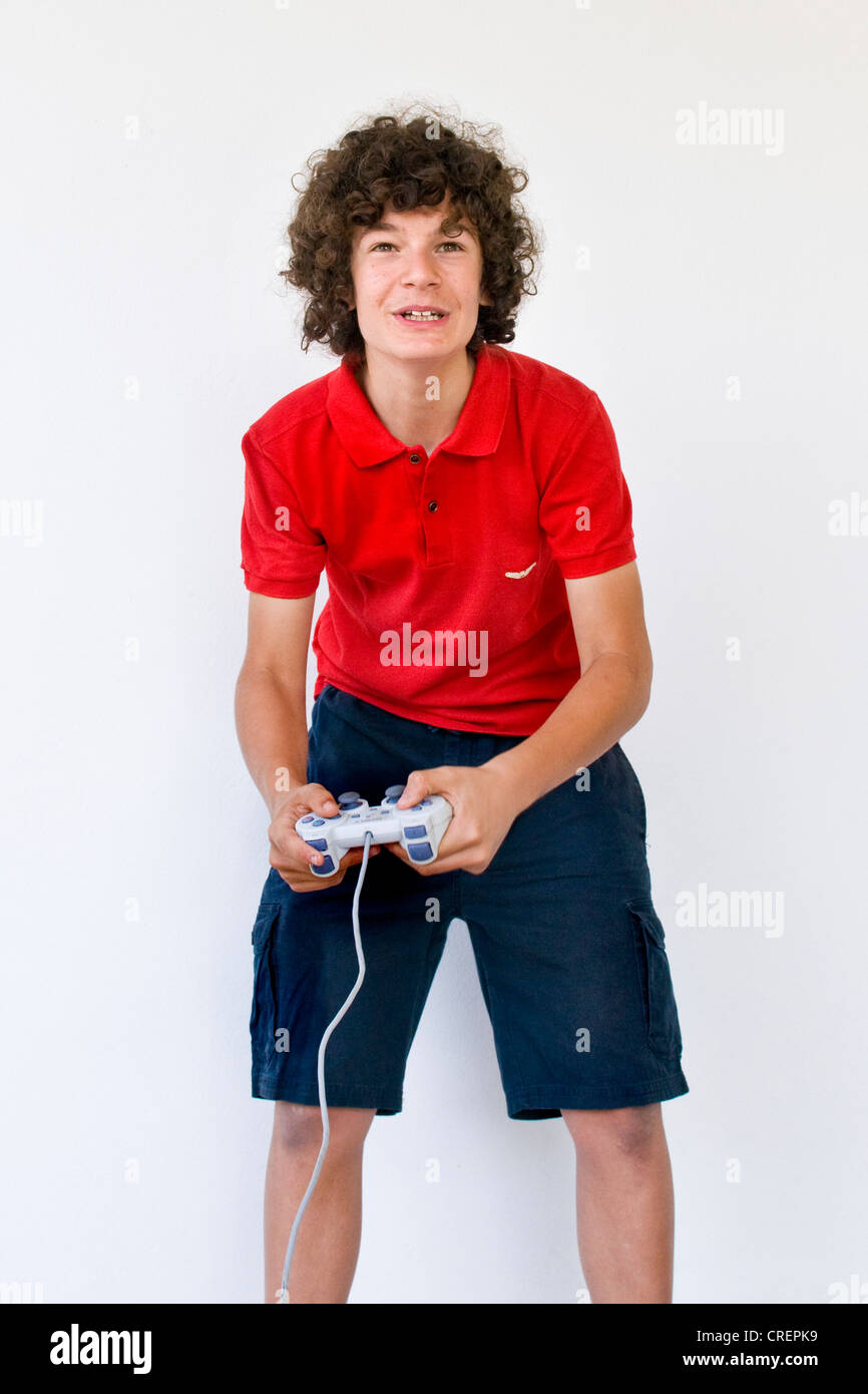 Boy playing video game Stock Photo - Alamy