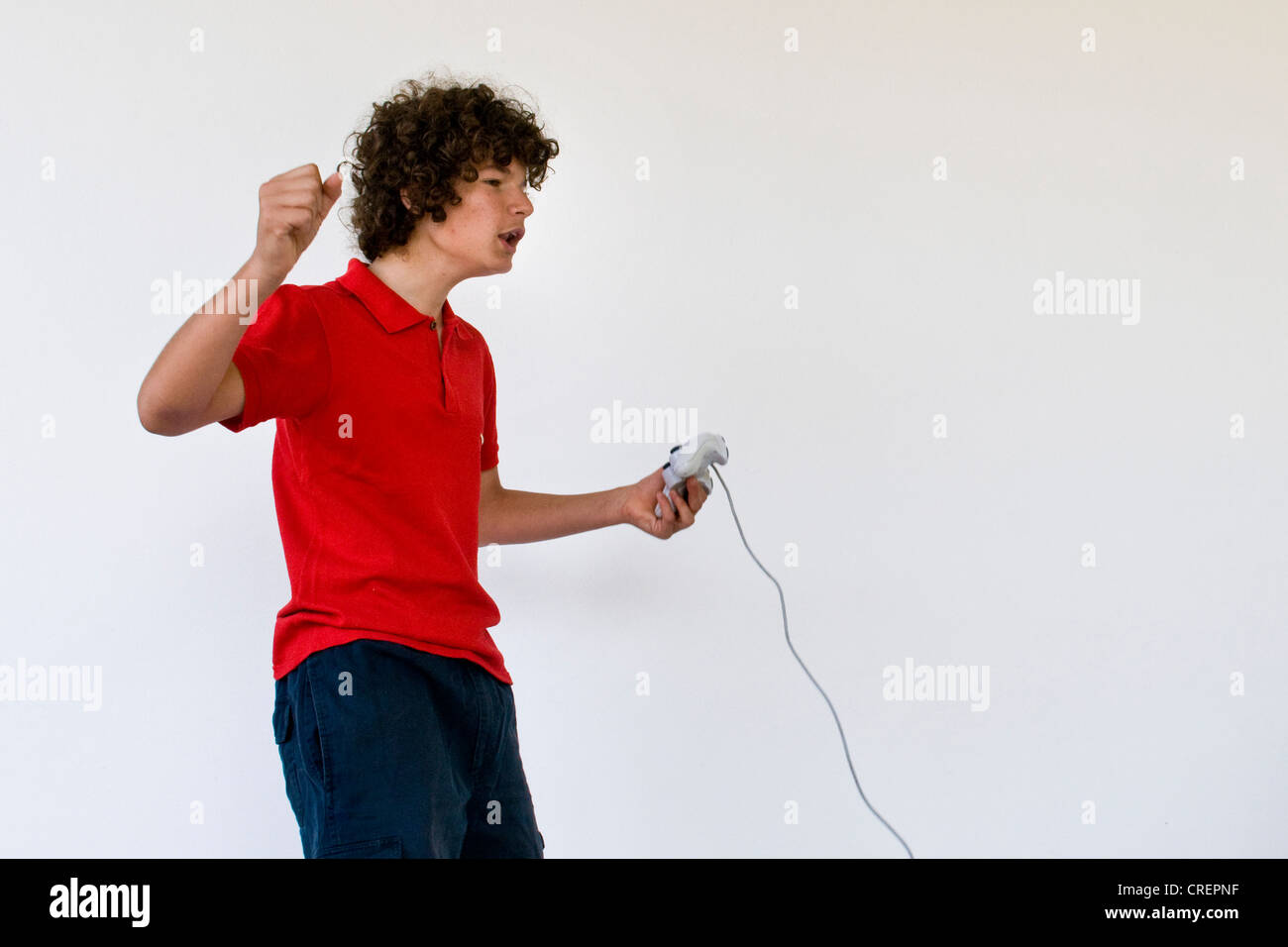 Boy playing video game Stock Photo - Alamy